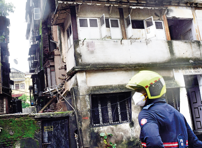 Two people hurt as part of Grant Road building collapses