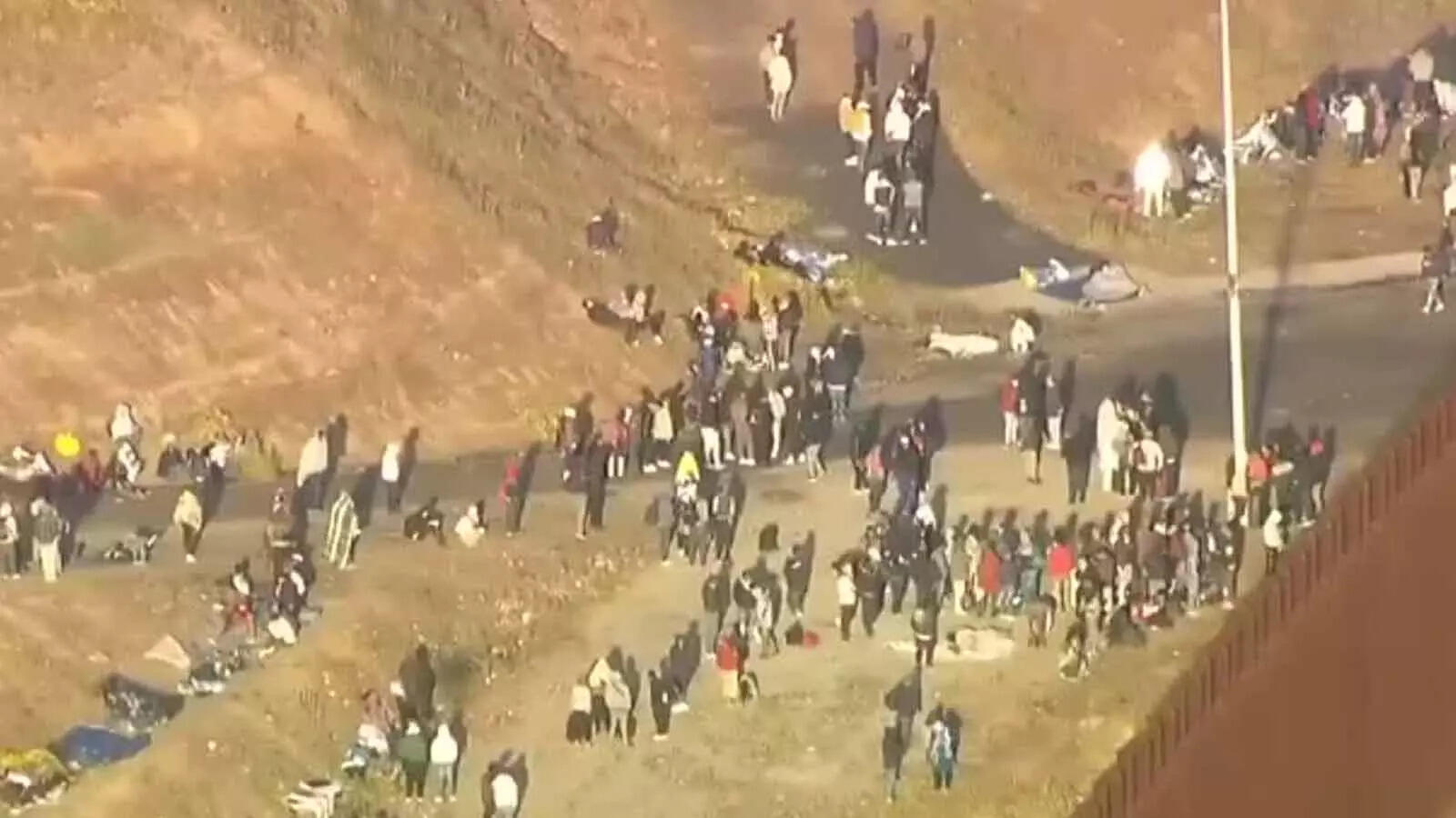 Migrants await fate at border