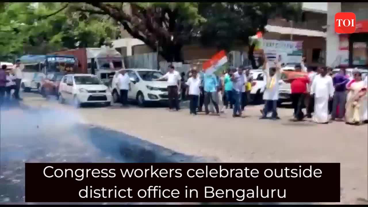 congress: Congress workers celebrate outside district office in Bengaluru