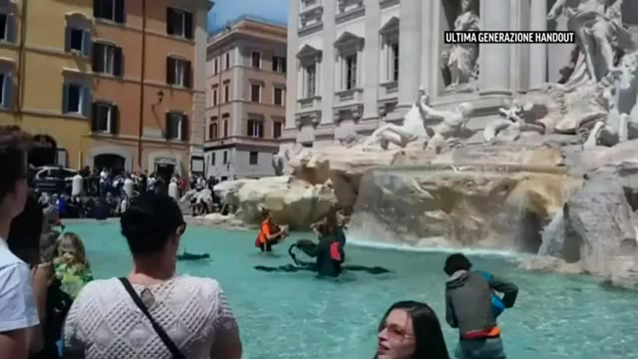 Activists pour black liquid into Rome's iconic Trevi Fountain