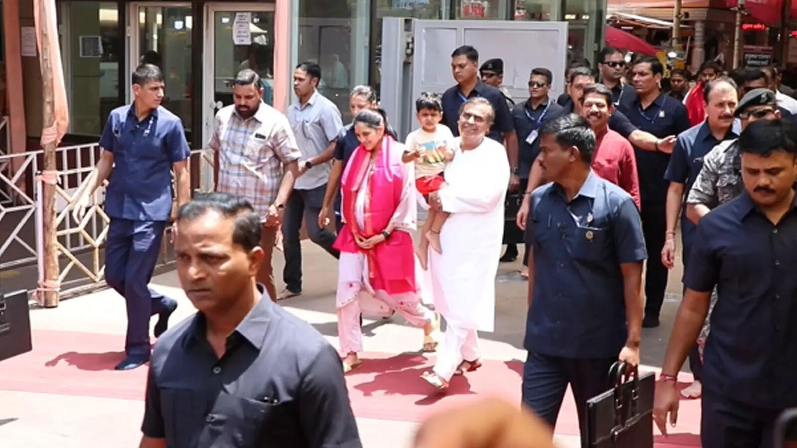 Watch: Mukesh Ambani carries his grandson Prithvi in arms at ...