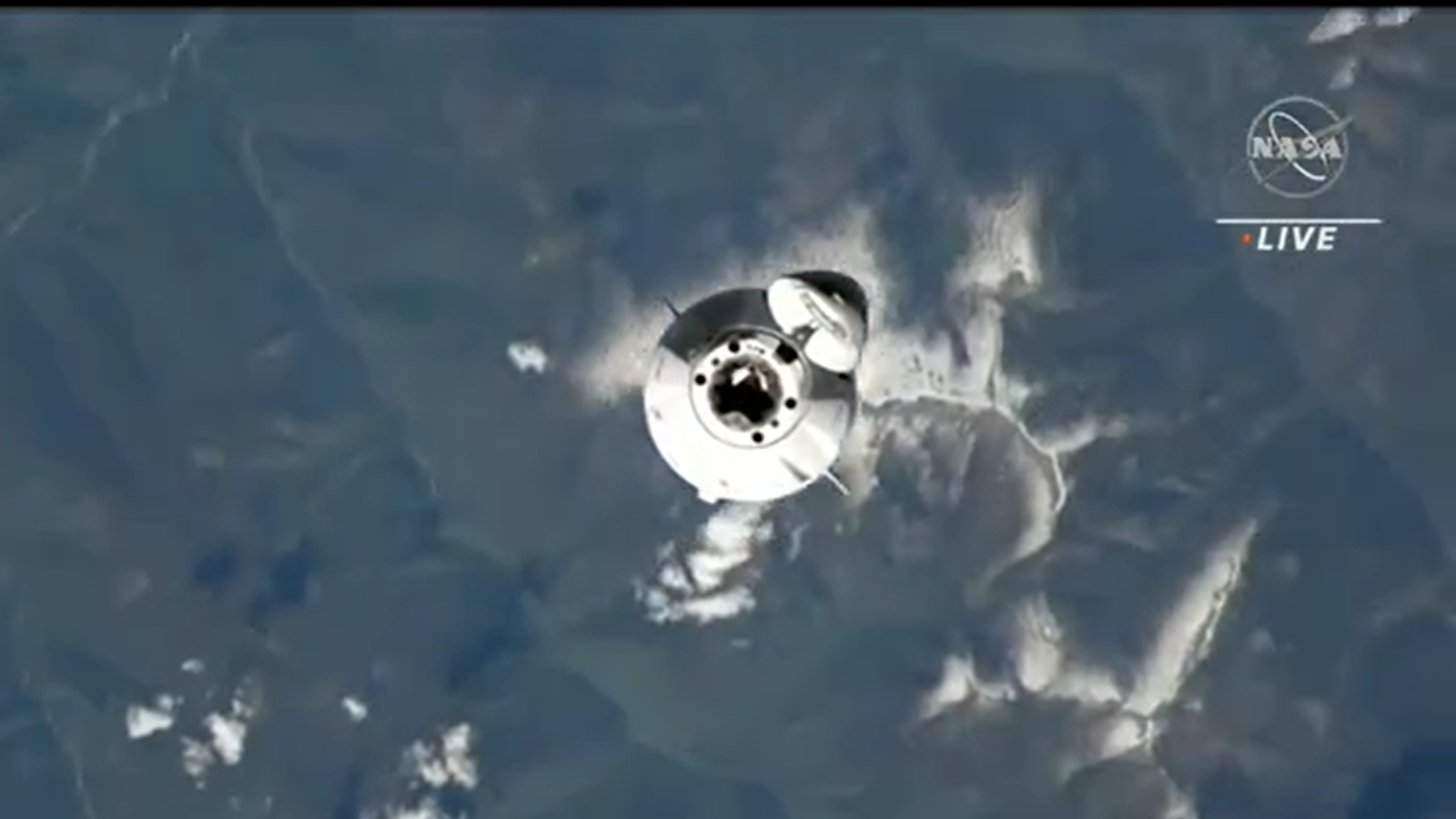 SpaceX cargo craft docks with space station