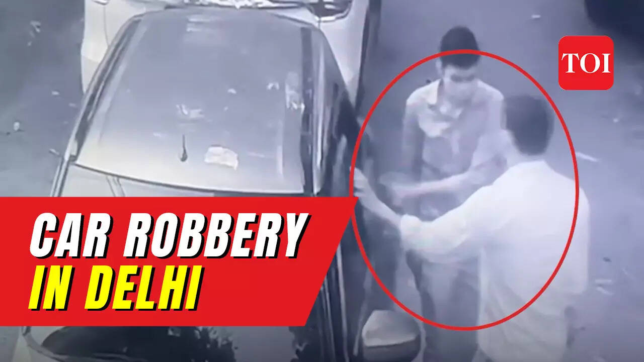 Watch: Daring car robbery unfolds in Delhi: Masked thieves flee with ...