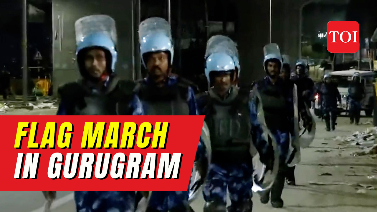 Gurugram communal violence: Rapid Action Force conducts flag march in ...