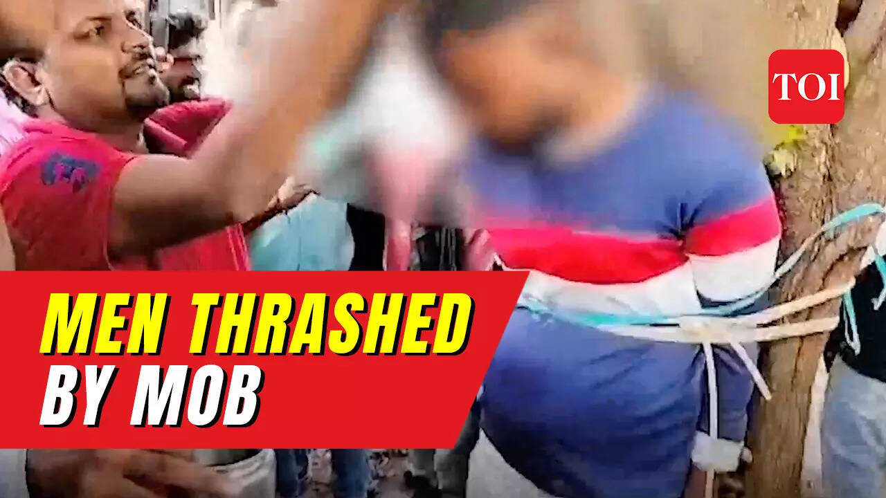On cam: Two men tied to tree, their heads tonsured and assaulted by mob ... On cam: Two men tied to tree, their heads tonsured and assaulted by mob ...