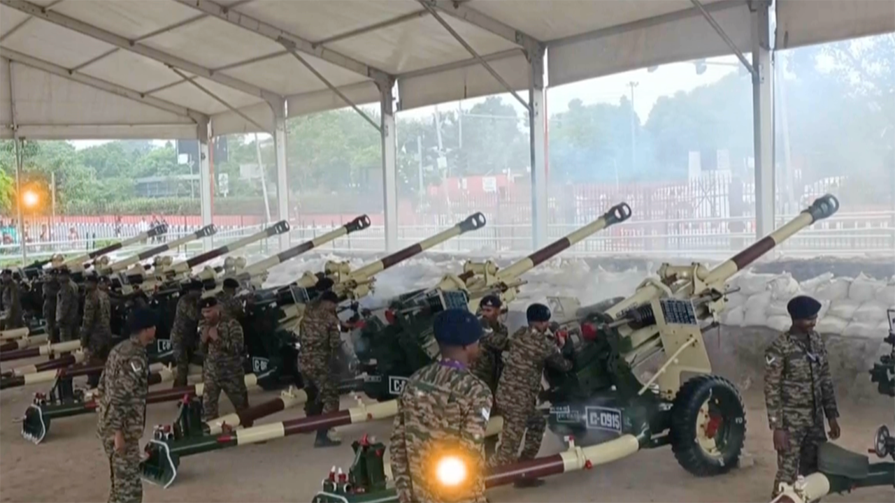105mm Light Field guns participate in ceremonial firing during ...