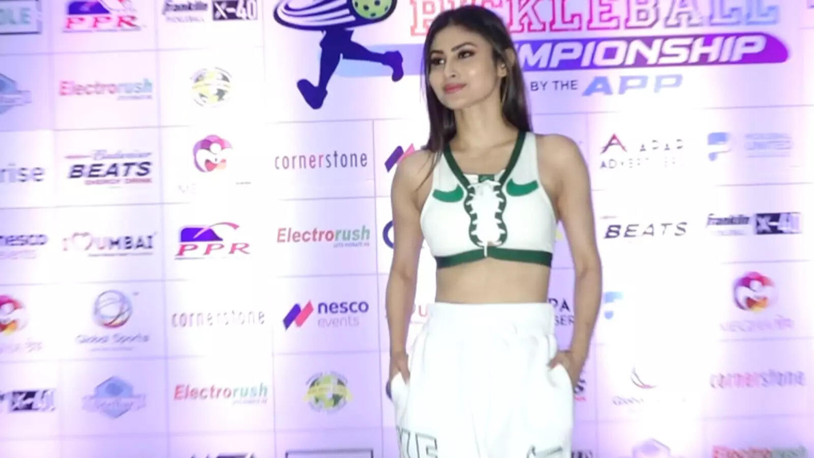 Mouni Roy keeps it quite sporty with white bold striped crop top and ...