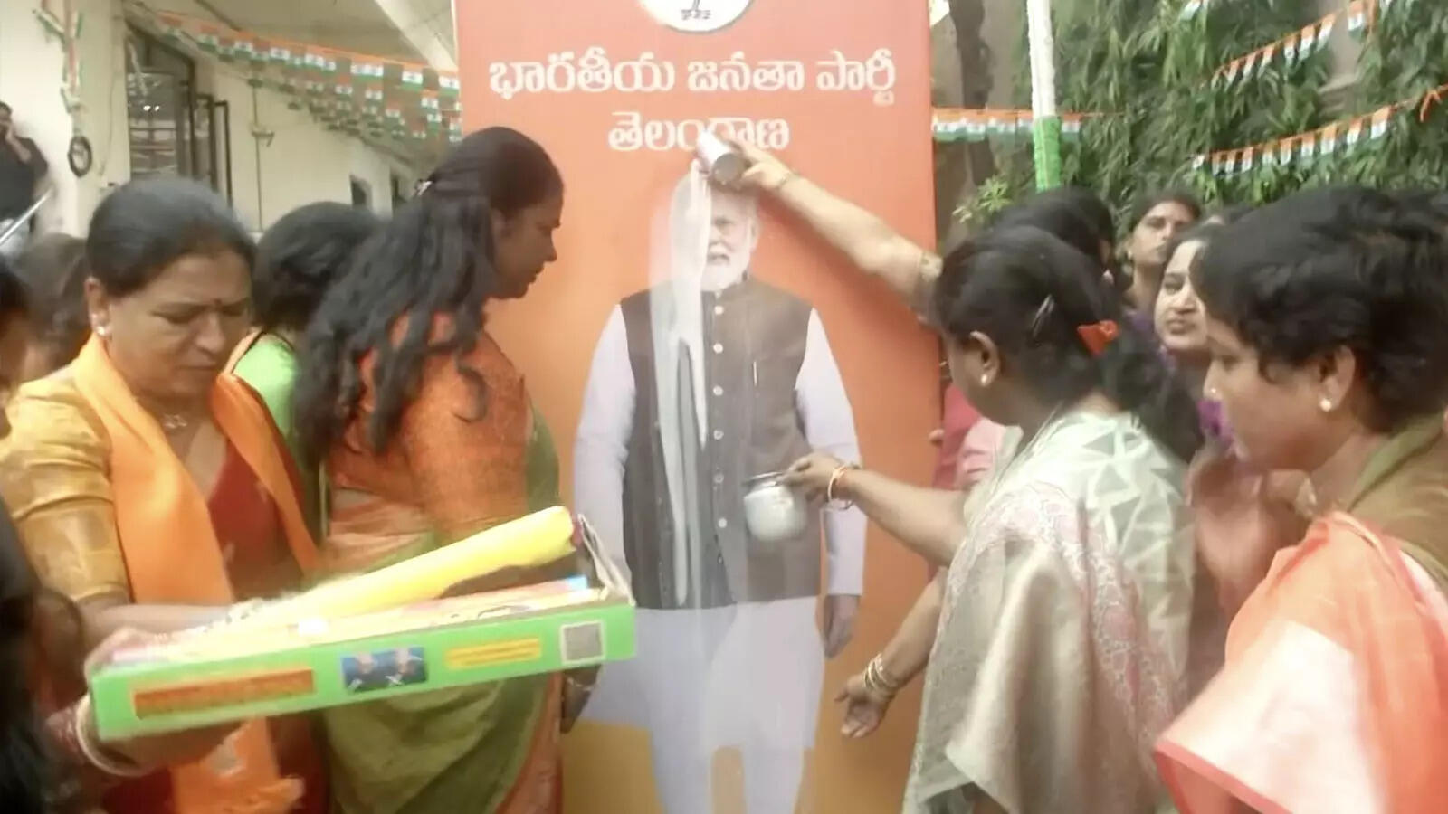women's reservation bill: Hyderabad: BJP women workers pour milk on PM Modi’s poster after ...