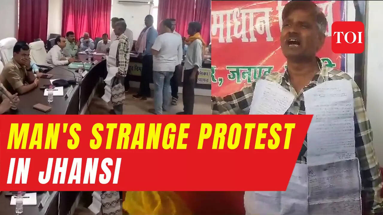 Man with garland of complaints appears before officials at Sampoorna ...