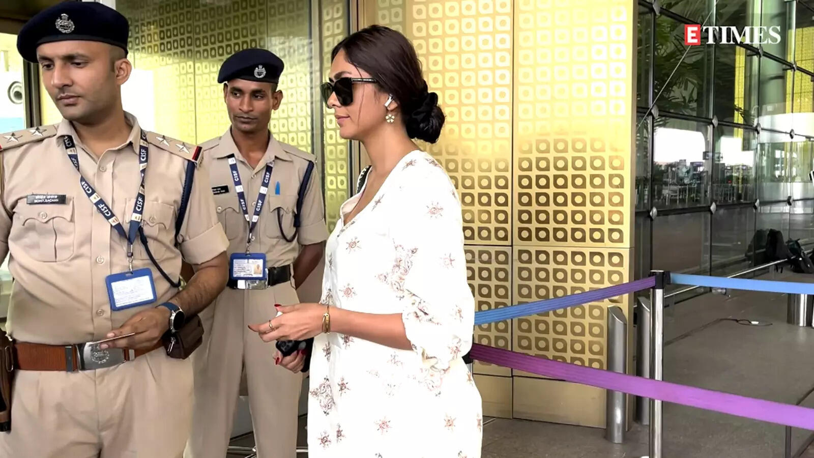 Mrunal Thakur glows in all-white look, asks permission from CISF official to enter the terminal ...