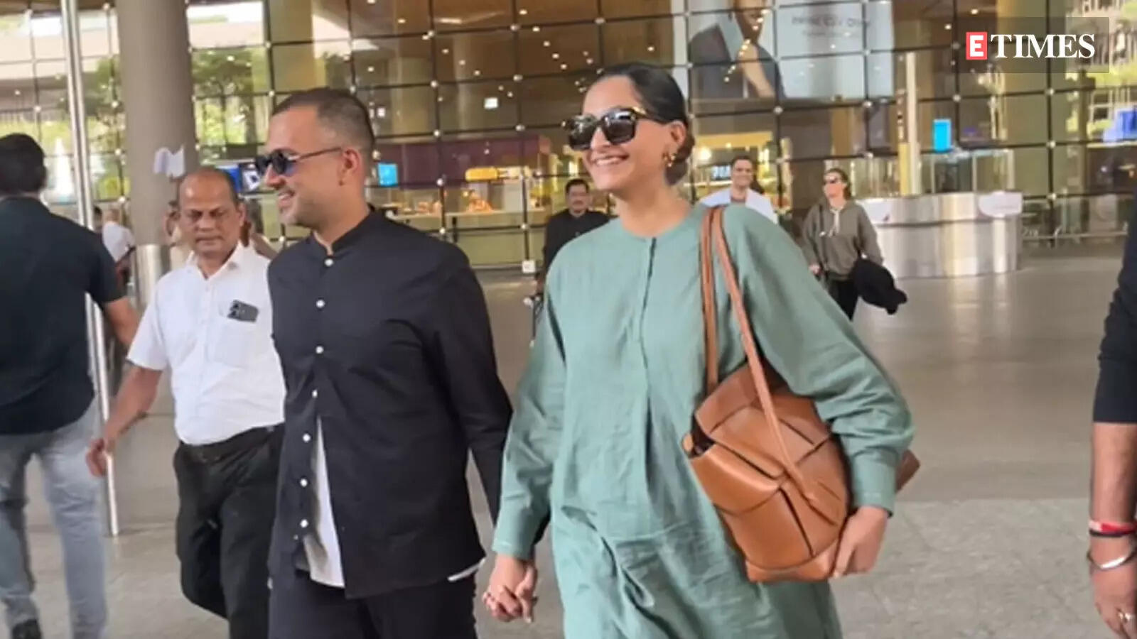 Couple goals! Sonam Kapoor and Anand Ahuja walk hand-in-hand at airport
