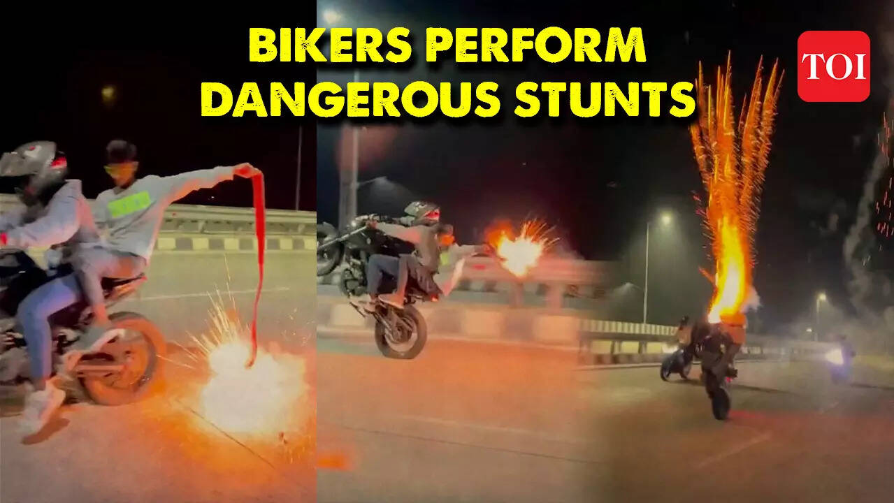 Video of bikers performing stunts and bursting firecrackers while ...