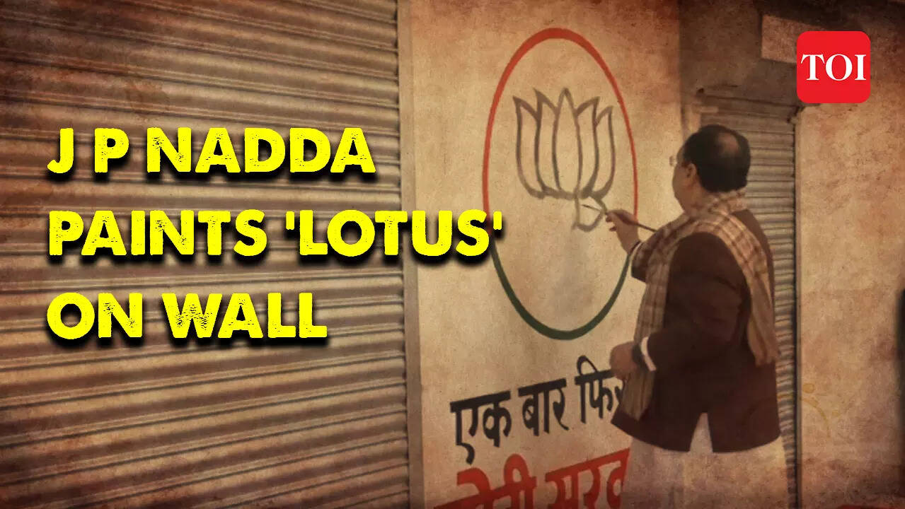 JP Nadda paints BJP's 'Lotus' symbol during launch of 'Wall Writing ...