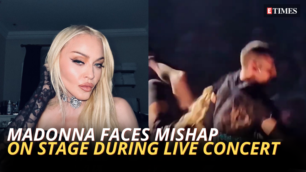 Madonna tumbles to floor as she accidentally falls from chair during a ...