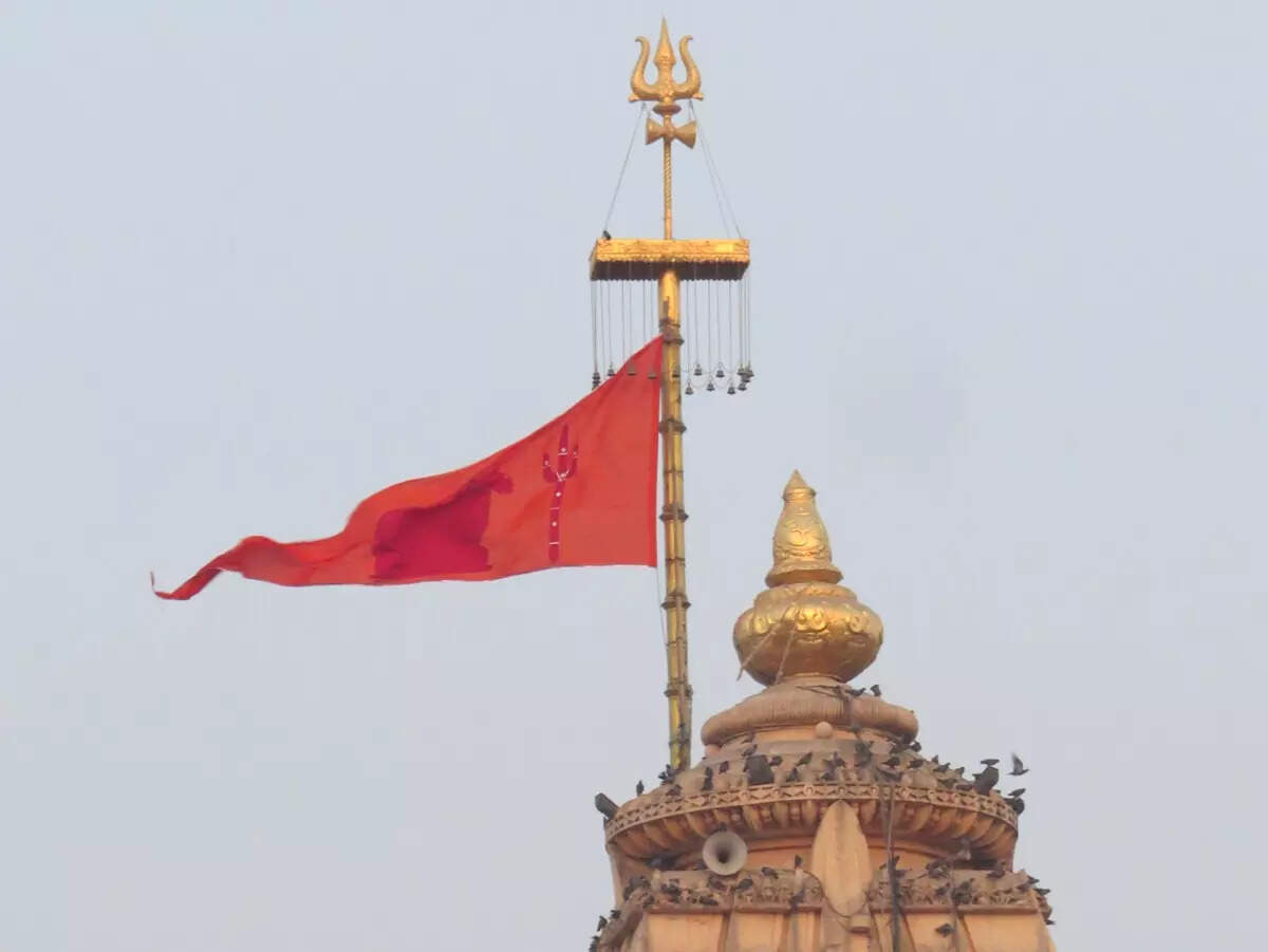 The significance of 'Dhwaja' or flag on the top of a temple