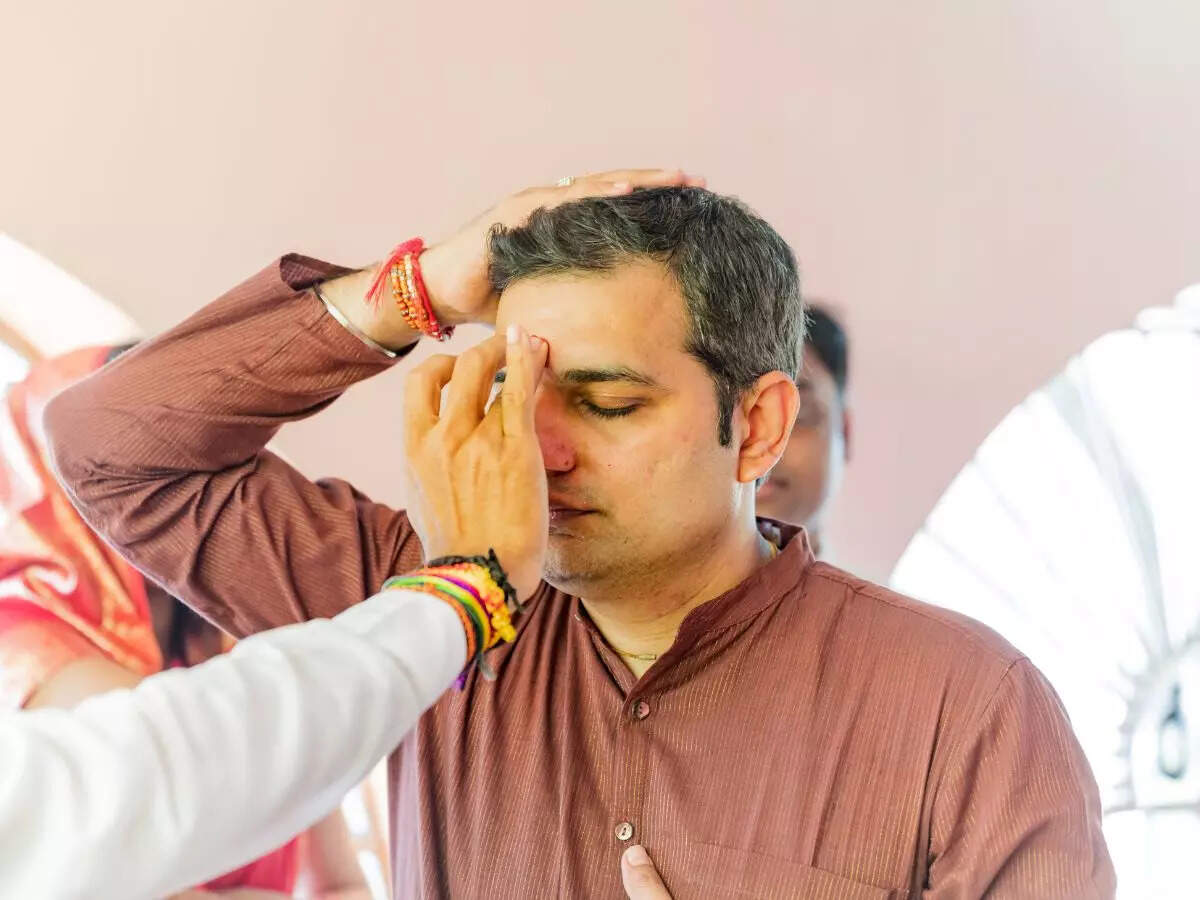 Which is the right finger to apply tilak?