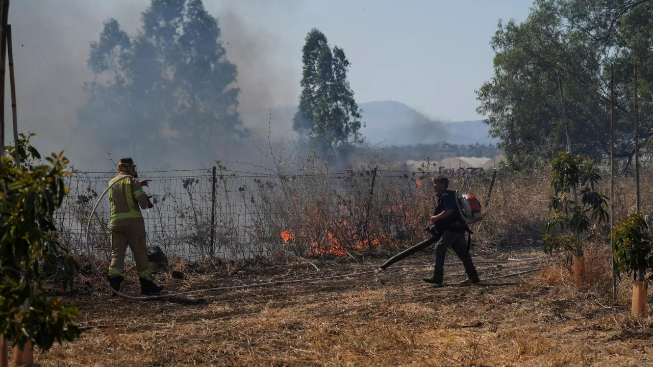 Hezbollah rains rockets on Israel after strike kills commander
