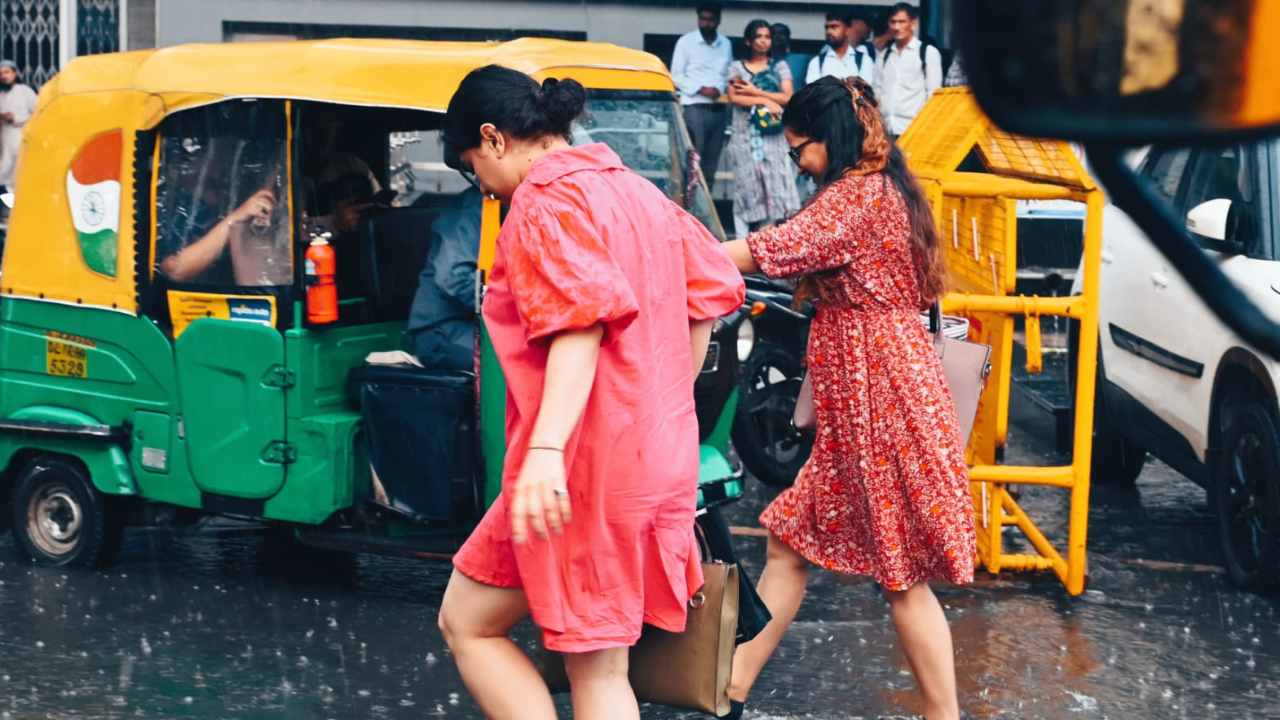 Umbrellas out as Delhi drenched in monsoon drizzle