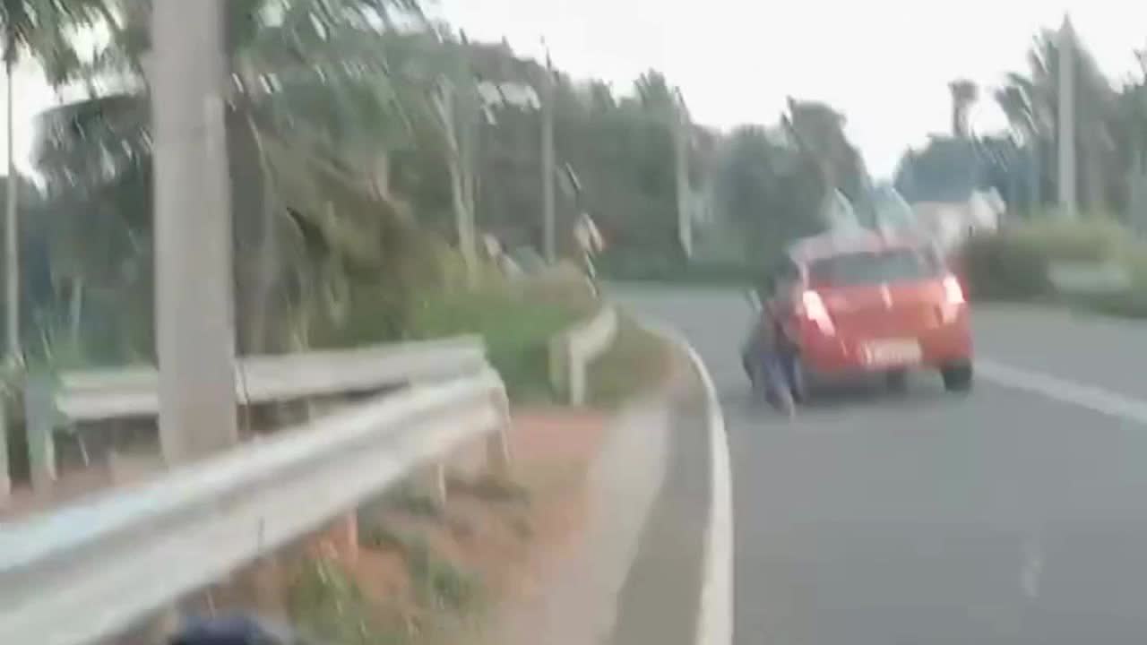 Tribal man being dragged by car