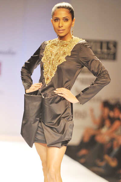A model showcases a creation by designer Preeti Chandra at Wills ...
