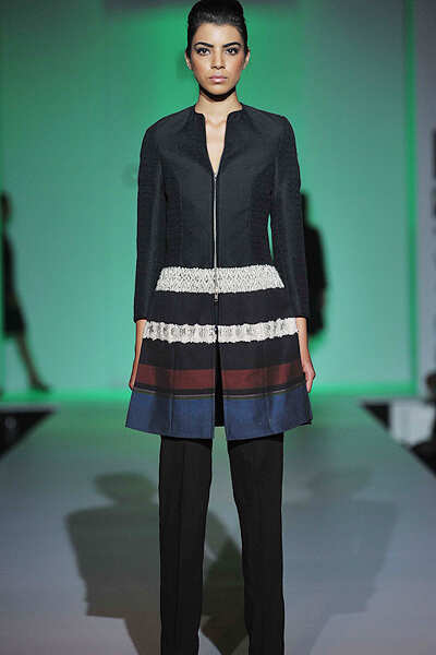 A model walks the ramp to display a creation by designer Gaurav Jai ...