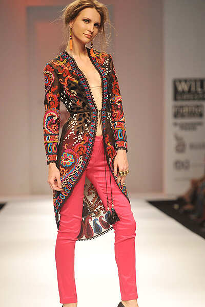 A model flaunts a creation by designer Rajdeep Ranawat on Day 3 of the ...