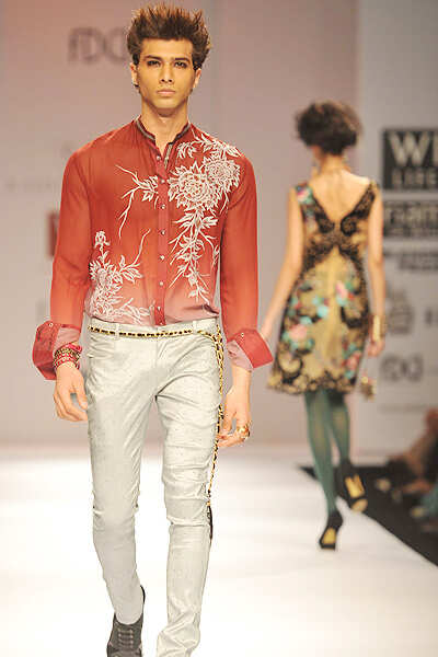 A model flaunts a creation by designer Rajdeep Ranawat on Day 3 of the ...
