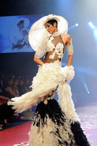 Jesse Randhawa showcases a creation by designer Ritu Beri during the ...