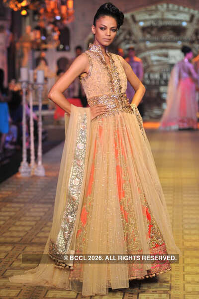 Noyonika Chatterjee showcases a creation by designer Manish Malhotra during the Day 4 of PCJ ...