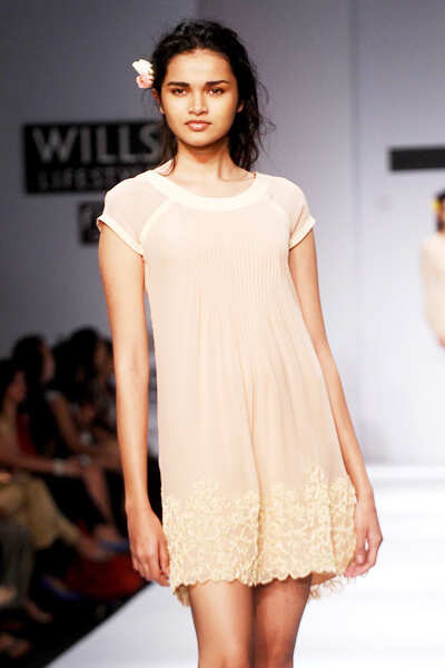 A model displays a creation by designer Manish Gupta on Day 3 of Wills ...