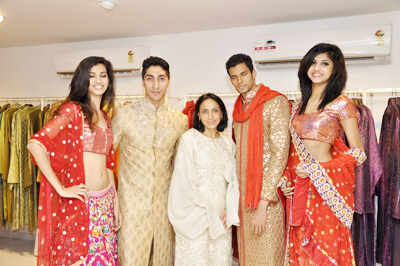 Designer Krishna Mehta (C) with models during her collection preview ...