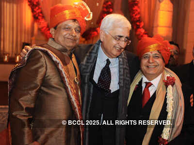 Salman Khurshid (C)and Navin Raheja (R), groom's father during the ...