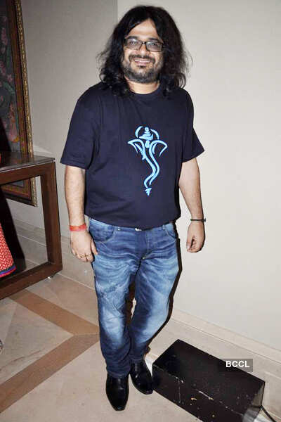 Music director Pritam seen in his regular disheveled look during the ...