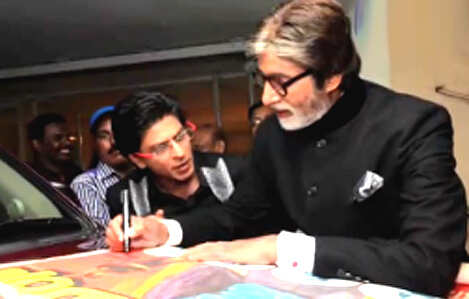 Big B signs autograph for Shah Rukh Khan