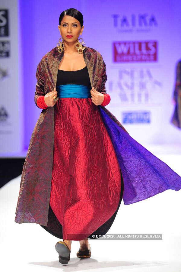 A model walks the ramp for designer Poonam Bhagat on Day 4 of the Wills ...