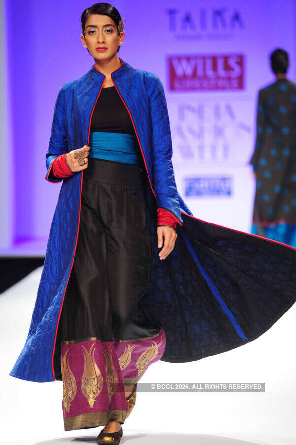 A model walks the ramp for designer Poonam Bhagat on Day 4 of the Wills ...