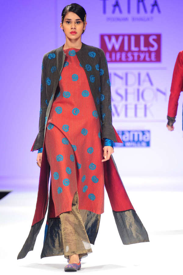 A model walks the ramp for designer Poonam Bhagat on Day 4 of the Wills ...