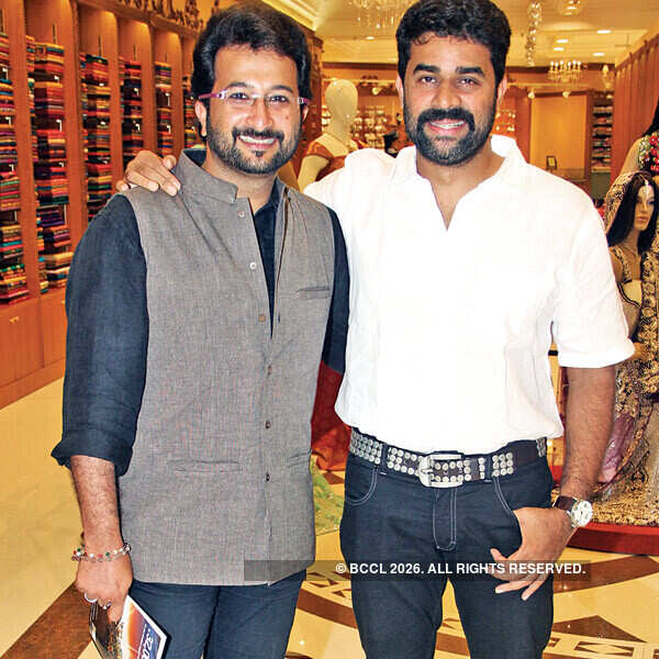 Nikhil and Vijay Babu pose during the cover launch of a magazine held ...