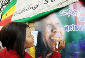 World pays tribute as 'improving' Mandela turns 95