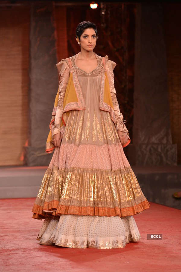 A model showcases a creation by designer Anju Modi on Day 1 of Delhi ...