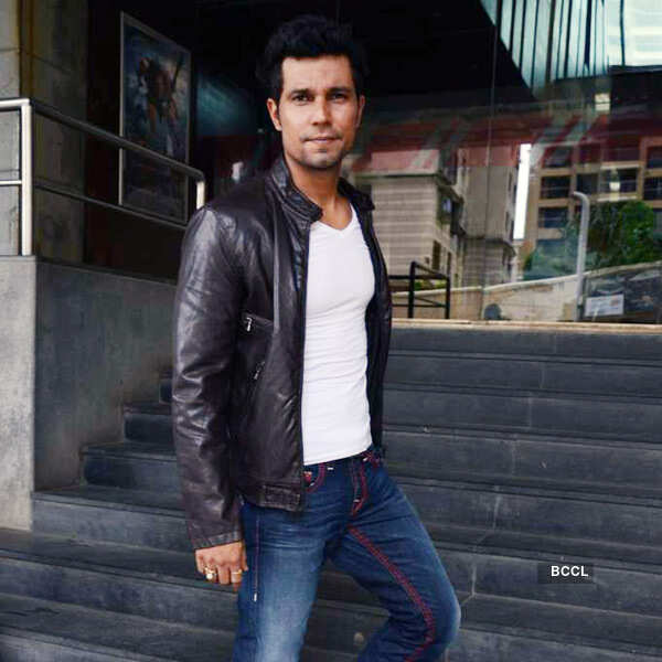 Randeep Hooda poses as he arrives for the first look launch event of ...