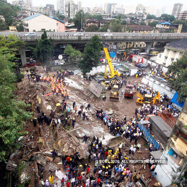 Indian Fire officials look for survivors from debris of a collapsed ...