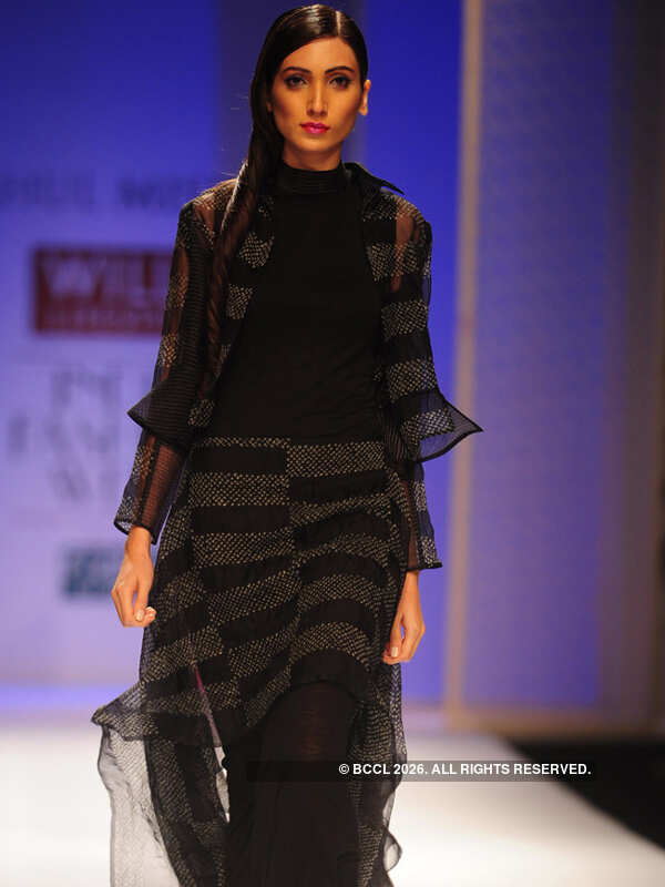 A model walks the ramp for fashion designer Rahul Mishra on Day 2 of ...