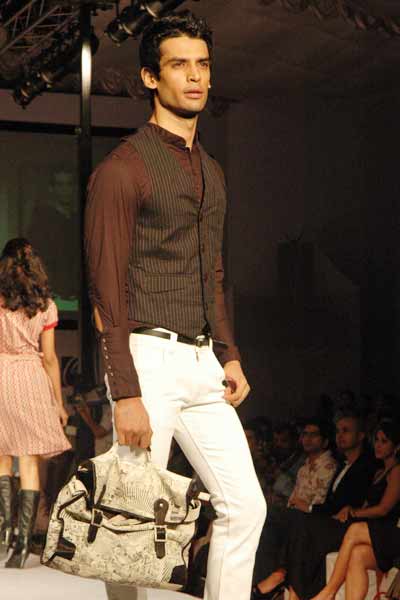 Model walks the ramp on the first day of mens fashion wear show ...