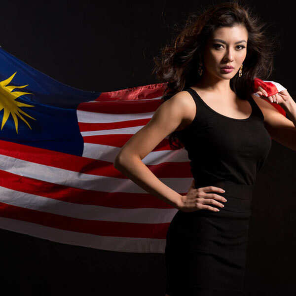 Miss Universe contestants pose with their national flags