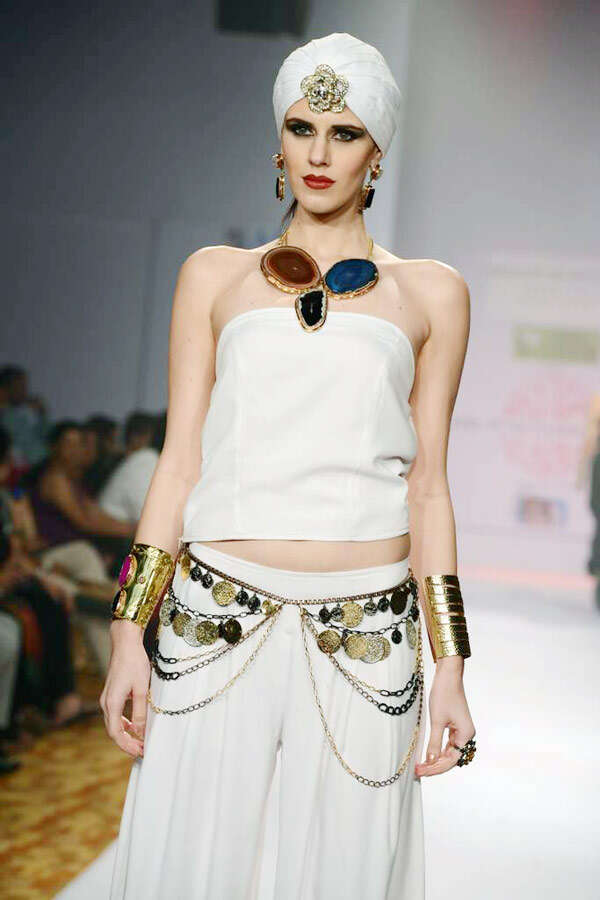 A model walks the ramp for designer Mona Shroff during ABIL Pune ...