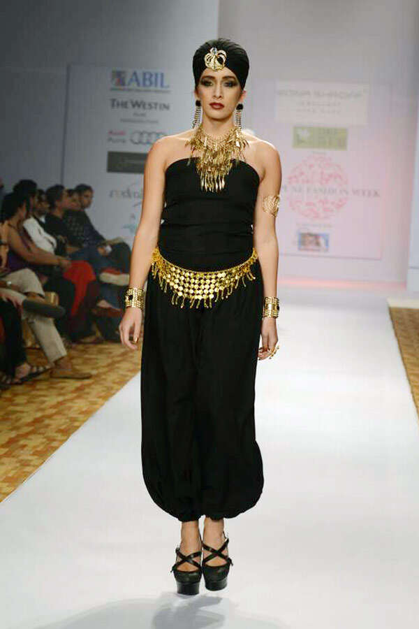 A model walks the ramp for designer Mona Shroff during ABIL Pune ...