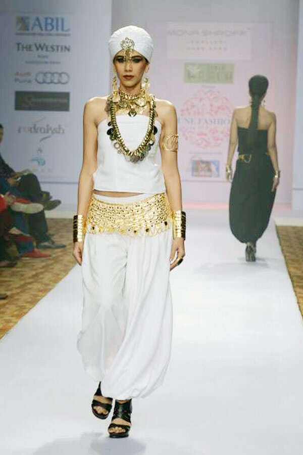 A model walks the ramp for designer Mona Shroff during ABIL Pune ...