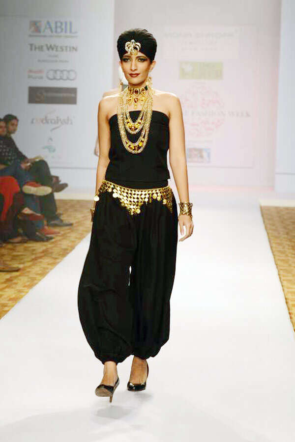 A model walks the ramp for designer Mona Shroff during ABIL Pune ...