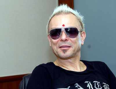 Rudolf Schenkel poses for the shutterbugs during a party in Mumbai ...